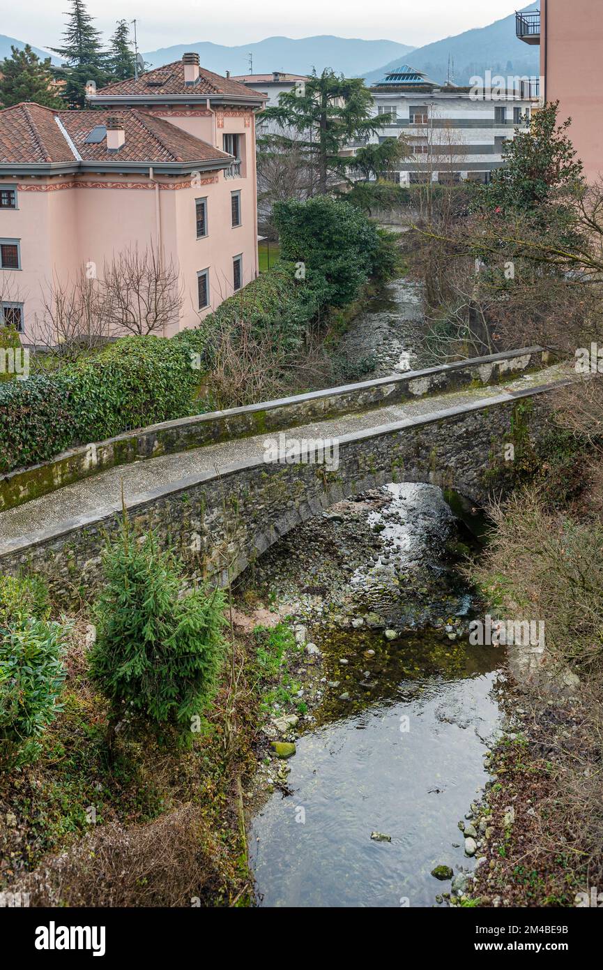 bridge on the albina stream, albino, italy Stock Photo - Alamy