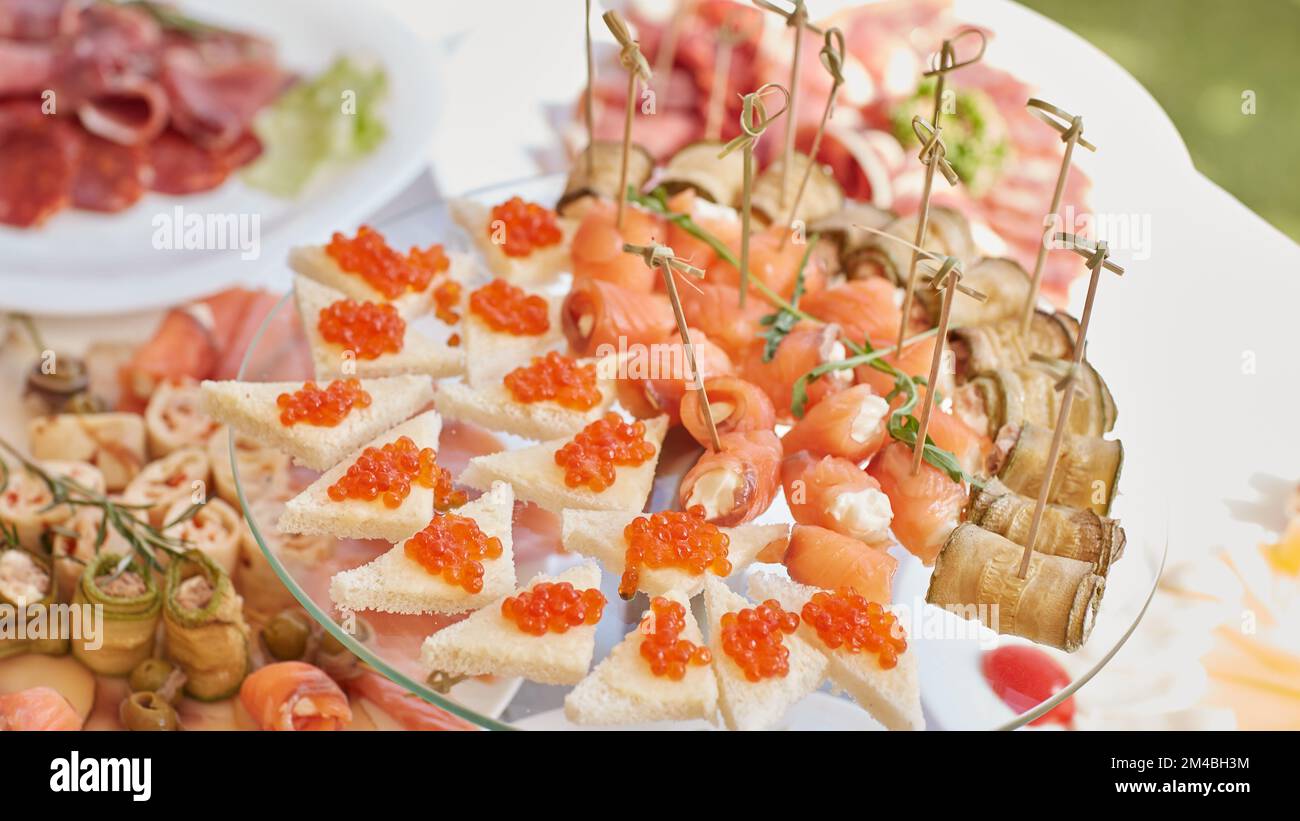 red caviar and salmon rolls with cottage cheese on the holiday table ...