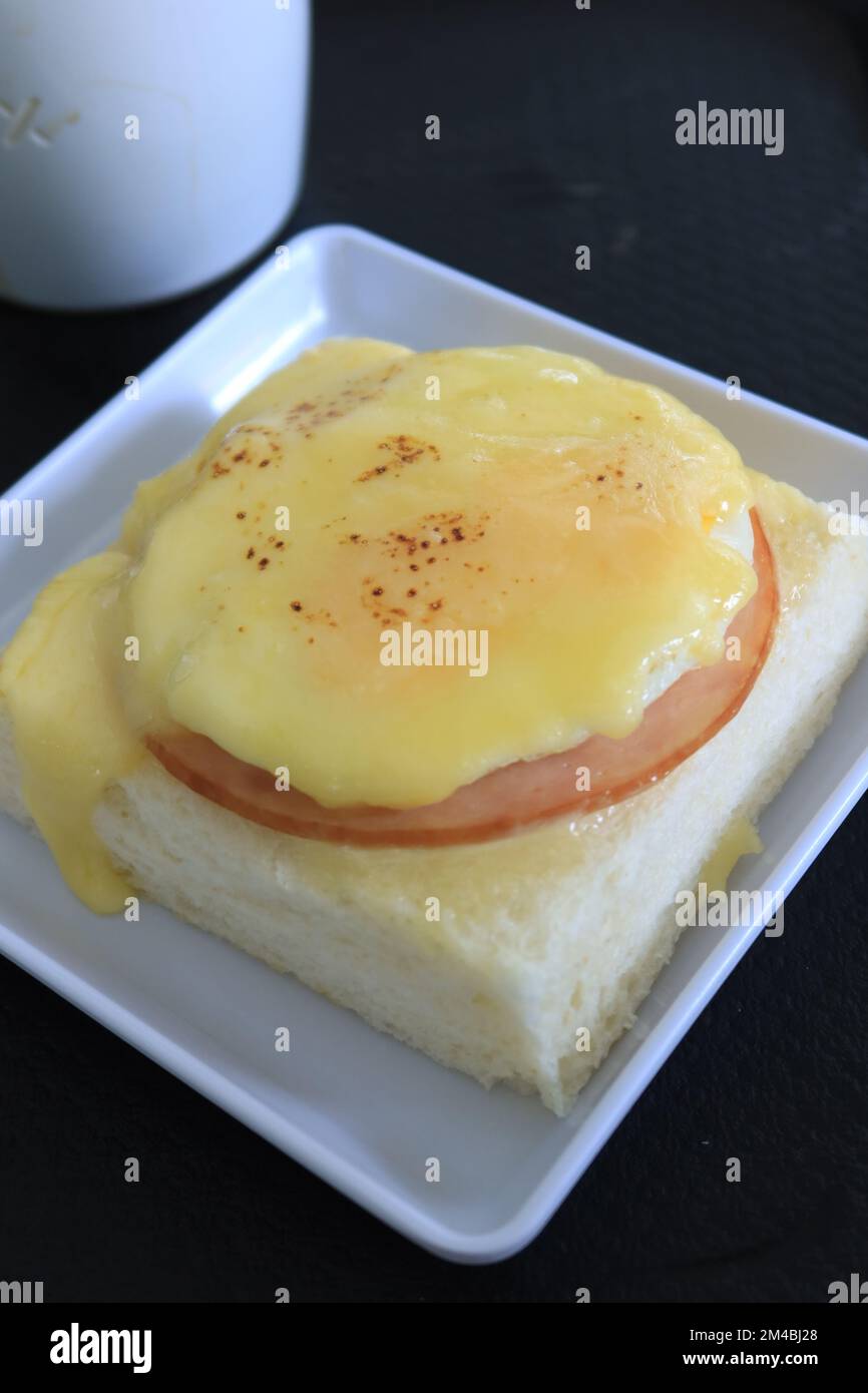 cured ham, egg and bread and cup of tea on table Stock Photo - Alamy