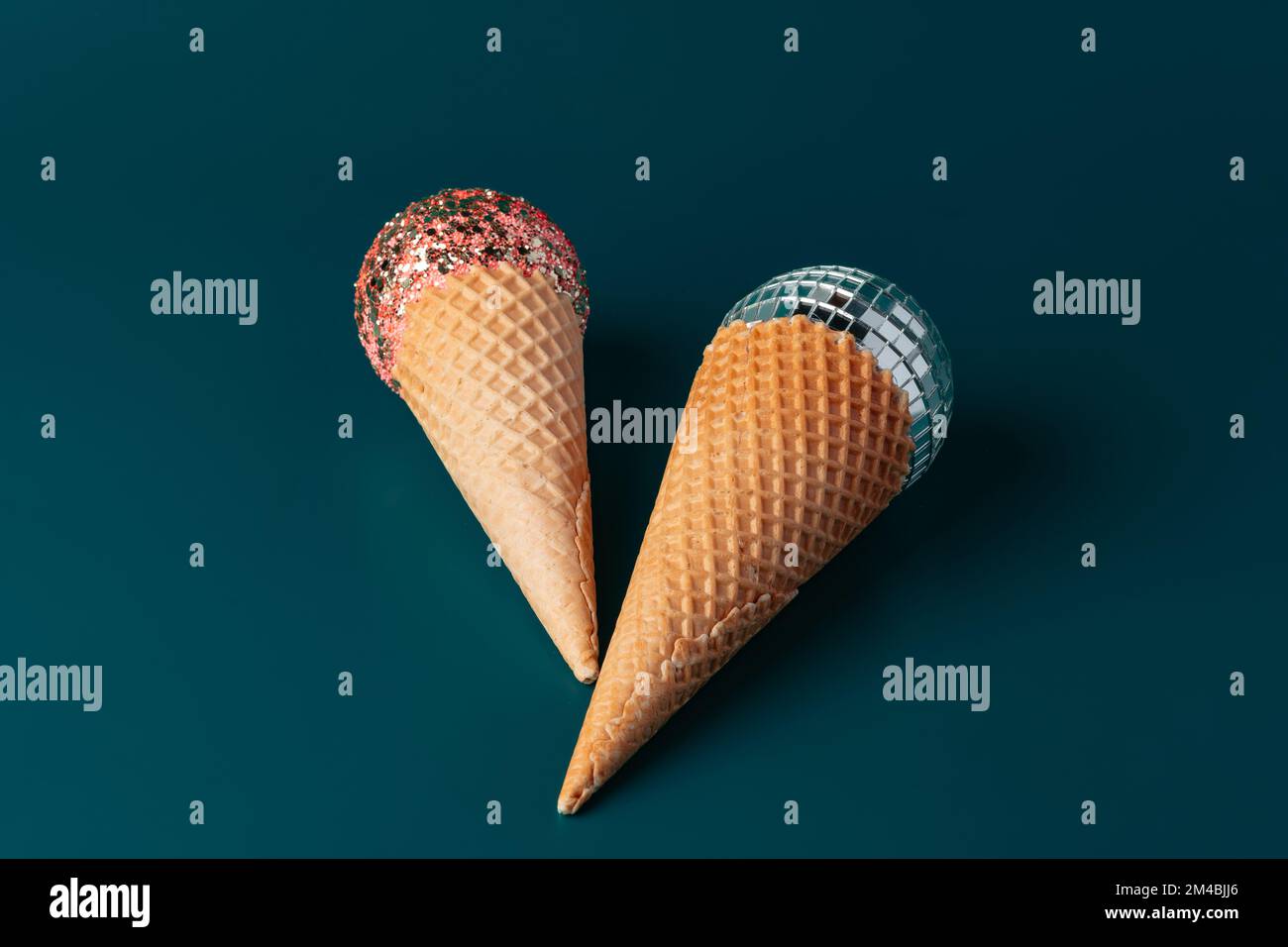 Christmas fun decorative fake ice cream cone on dark green background ...