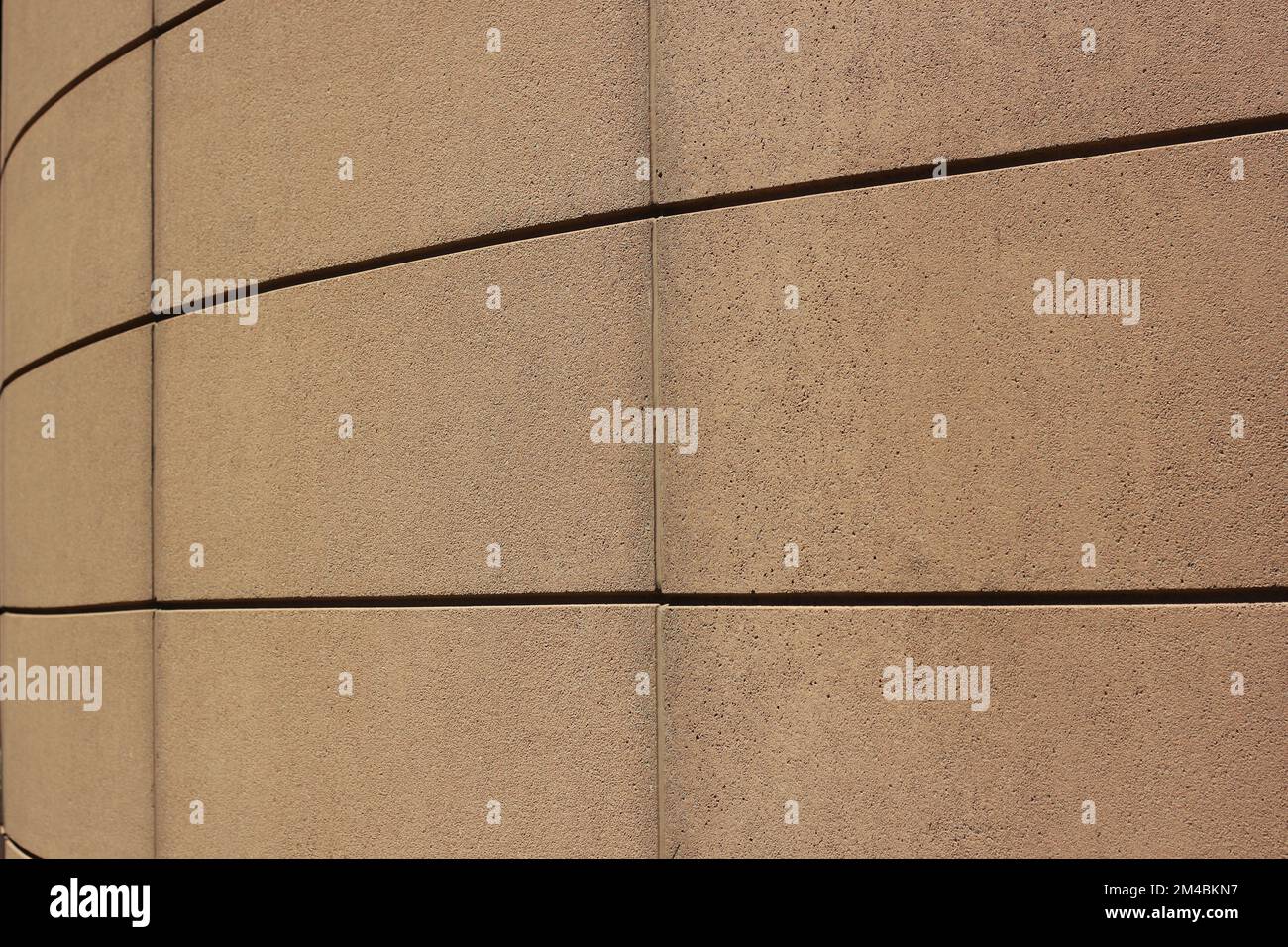 A curvy concrete wall surface with lines Stock Photo - Alamy