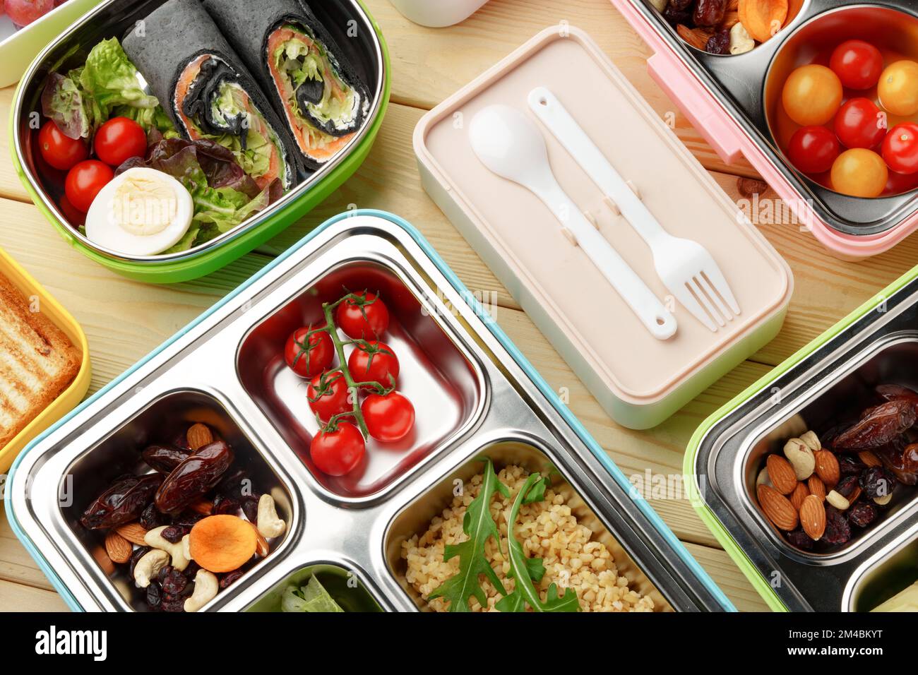 Containers with healthy food on wooden background top view Stock Photo ...