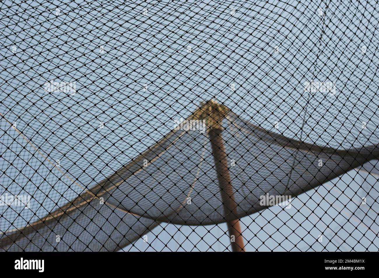 A typical common netting fabric draped over a pole as a security ...
