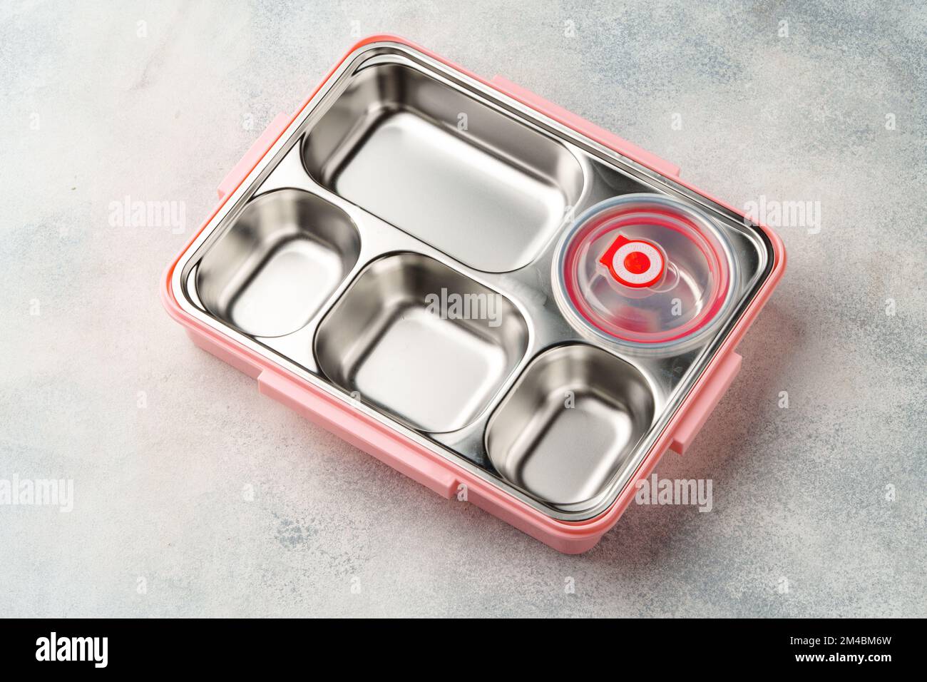 Plastic empty lunch box with metal compartments Stock Photo - Alamy