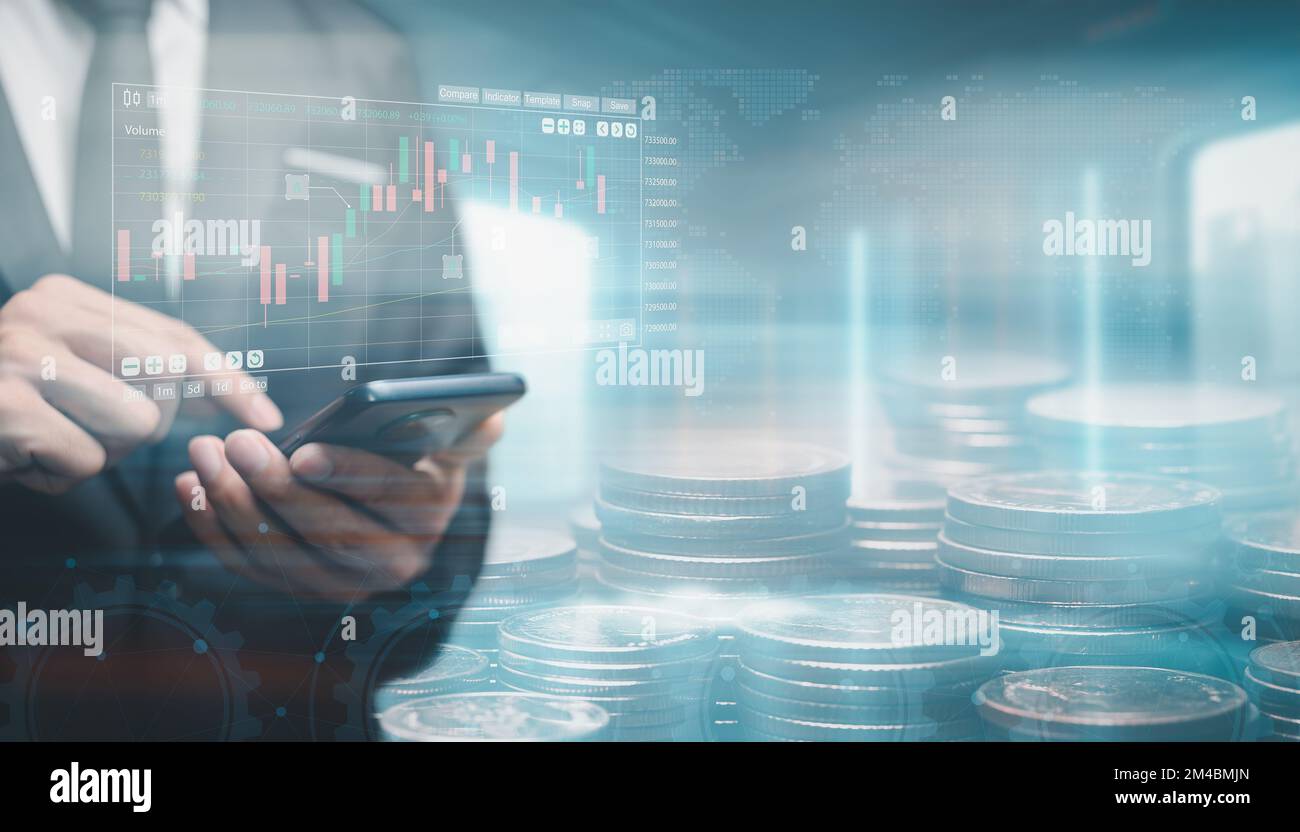 A businessman holding a tablet with forex trading graph-stock market ...