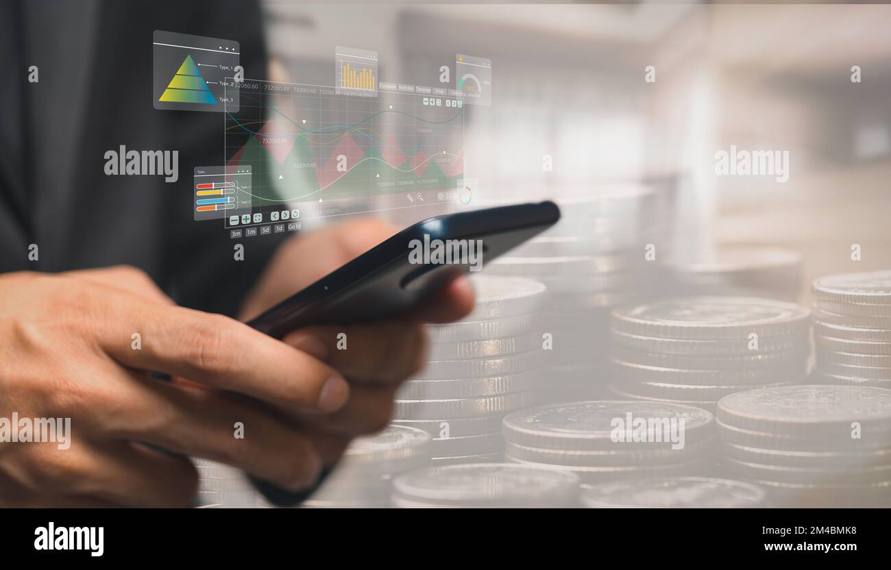 A businessman holding a tablet with forex trading graph-stock market ...