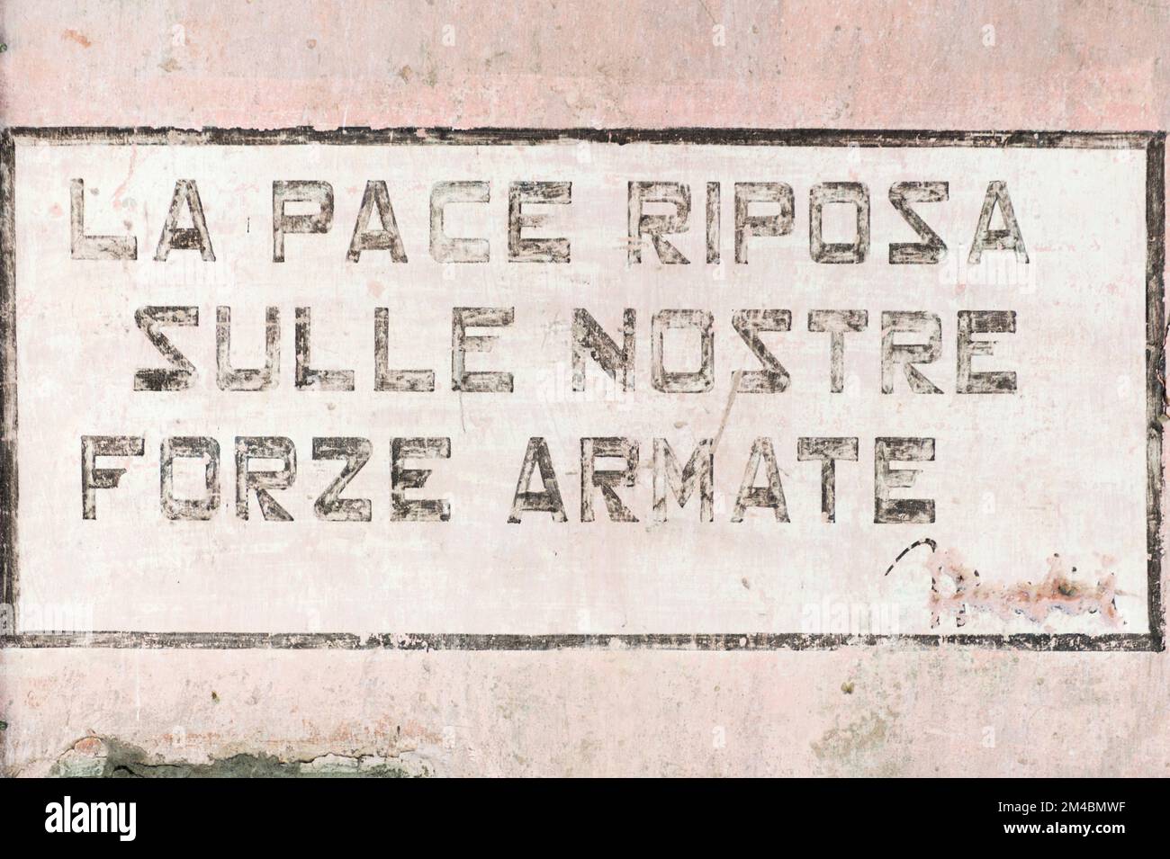 Old fascist propaganda inscription "Peace rests on our armed forces ...