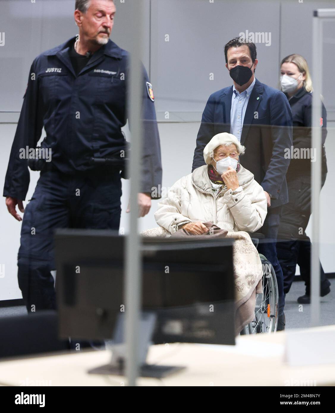 Itzehoe, Germany. 20th Dec, 2022. The defendant Irmgard F. is brought ...