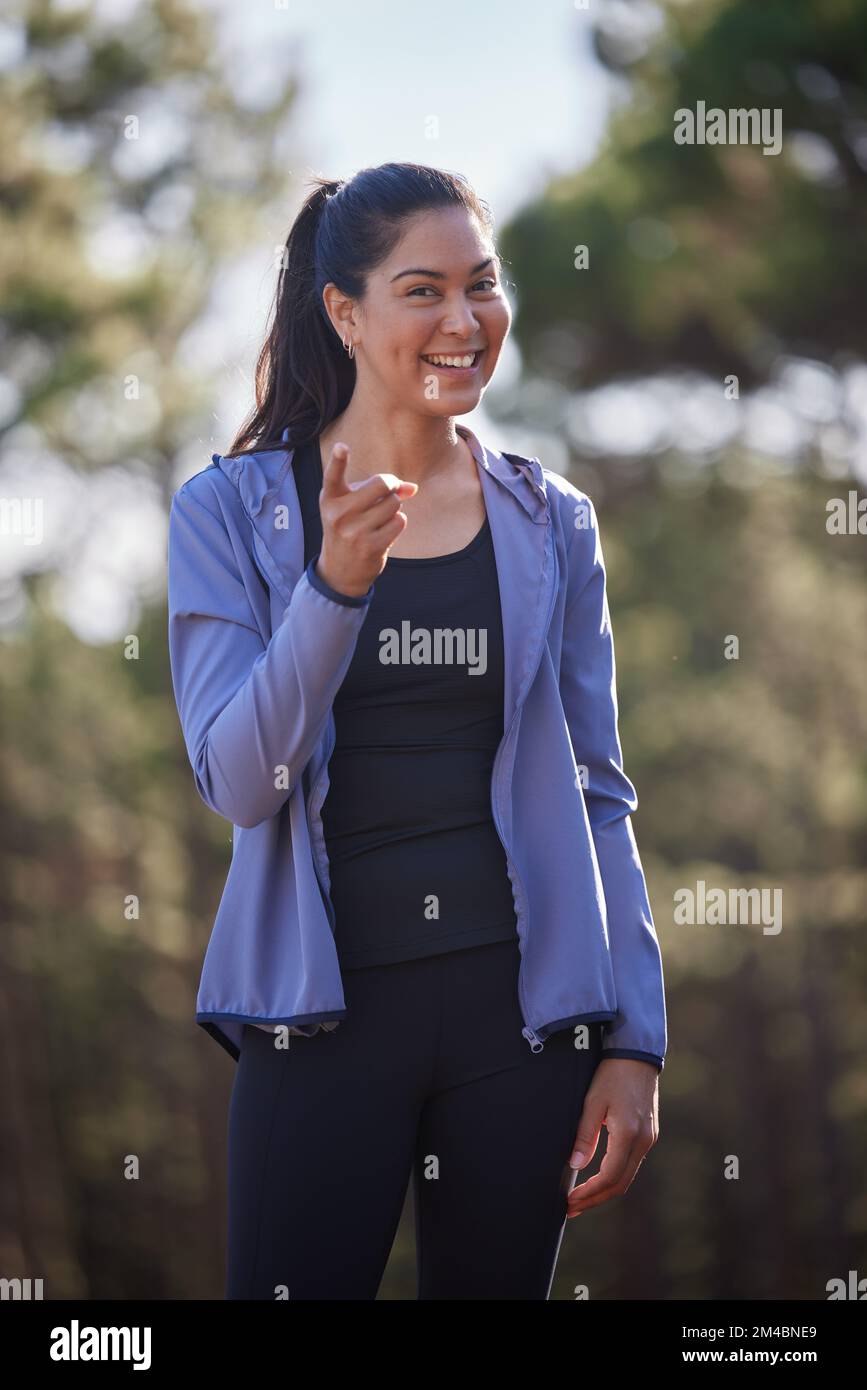 Fitness, park and portrait of woman pointing for motivation in exercise ...