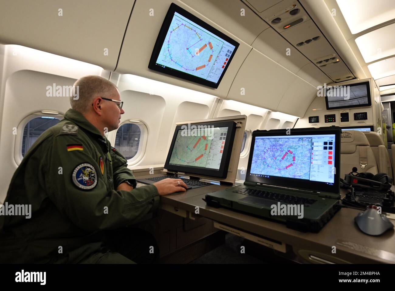 Cologne, Germany. 20th Dec, 2022. A crew member operates a computer on ...