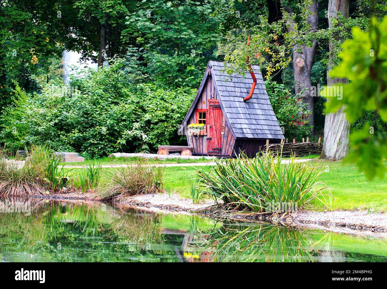 A dwarf house near pond in the beautiful countryside Stock Photo - Alamy