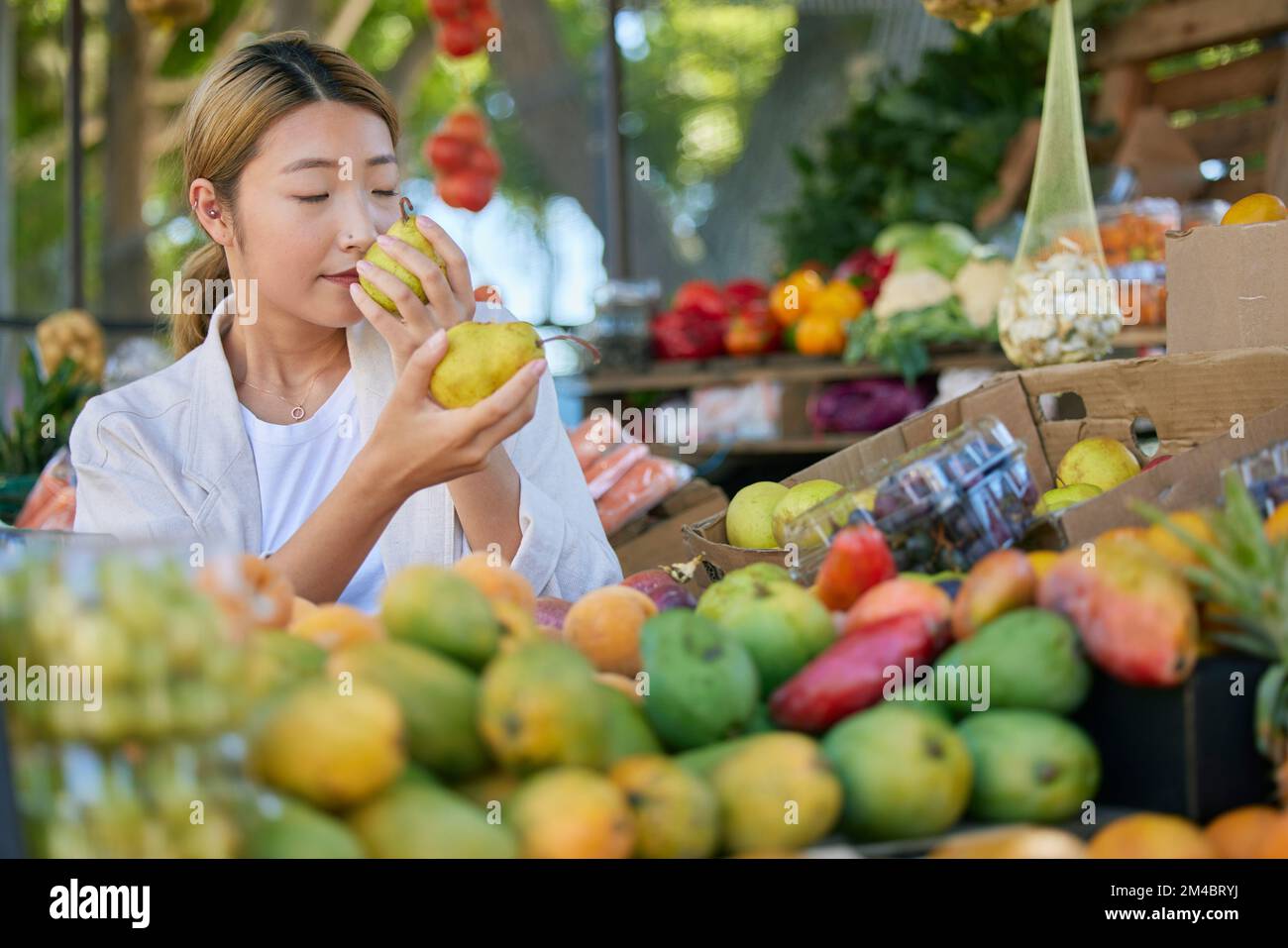 Fruits, food and woman in Japan market for quality choice, nutrition ...