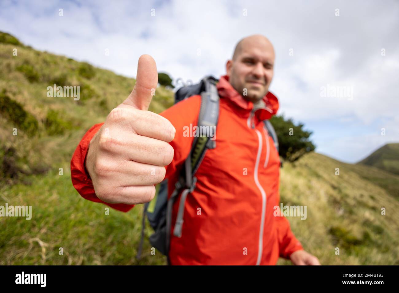 Hiker in red jacket giving a thumbs up Stock Photo - Alamy Hiker in red jacket giving a thumbs up Stock Photo - Alamy