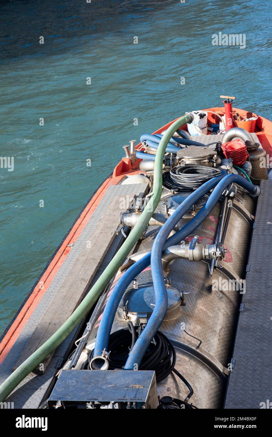 Close-up of a small Venetian residual sewage removal boat in a canal in ...