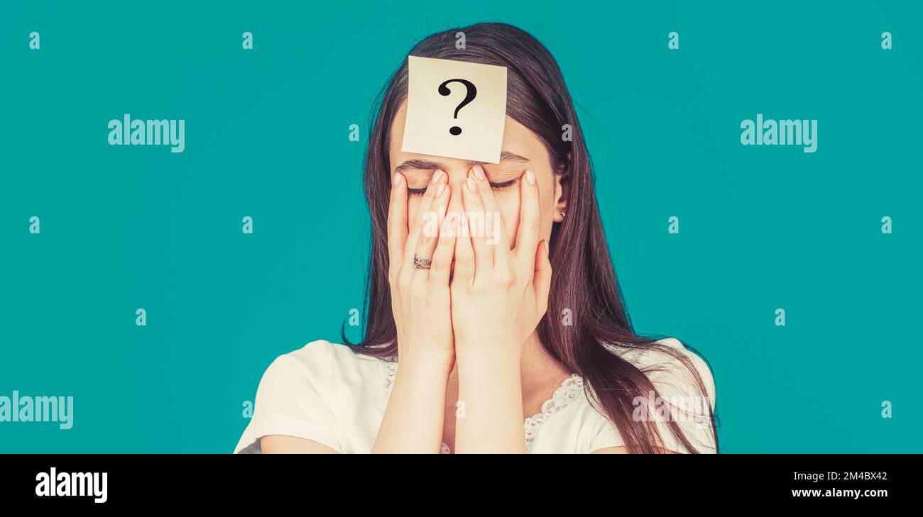 Paper notes with question marks. Doubtful girl asking questions to ...