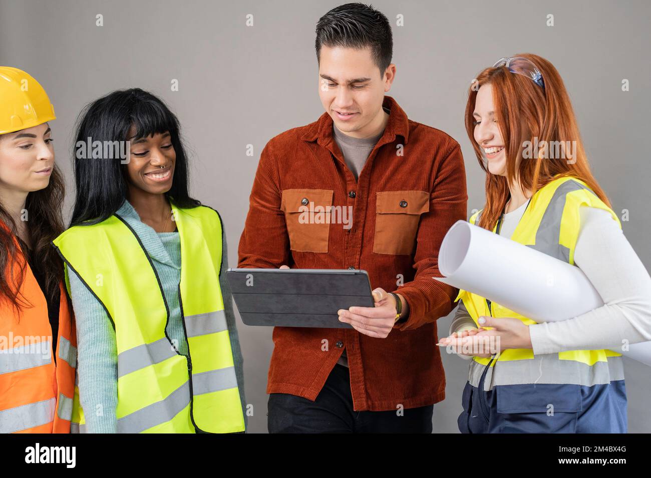 South american engineer supervisor at construction site with his ...