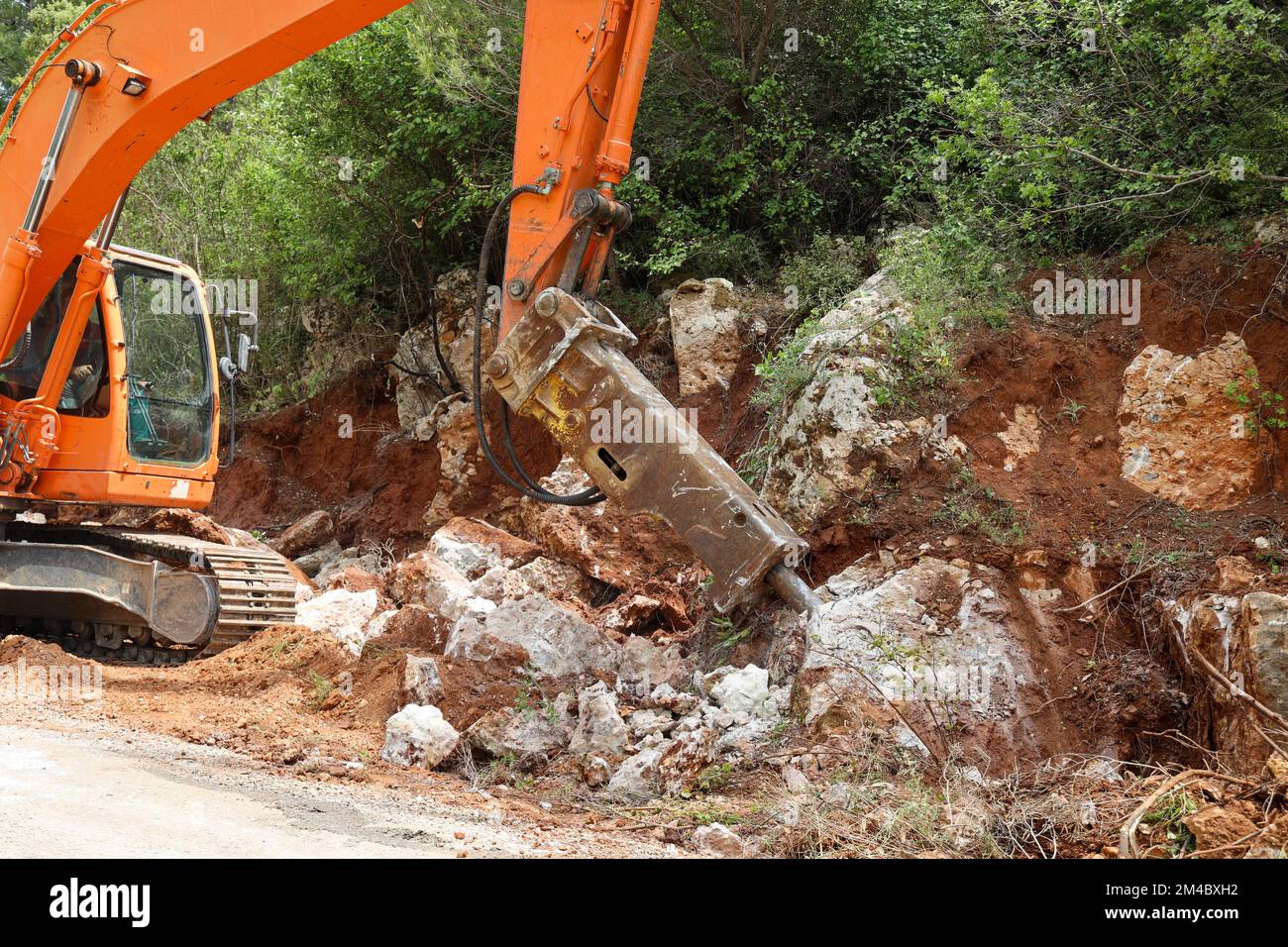 Construction machinery breaks concrete excavator hi-res stock ...