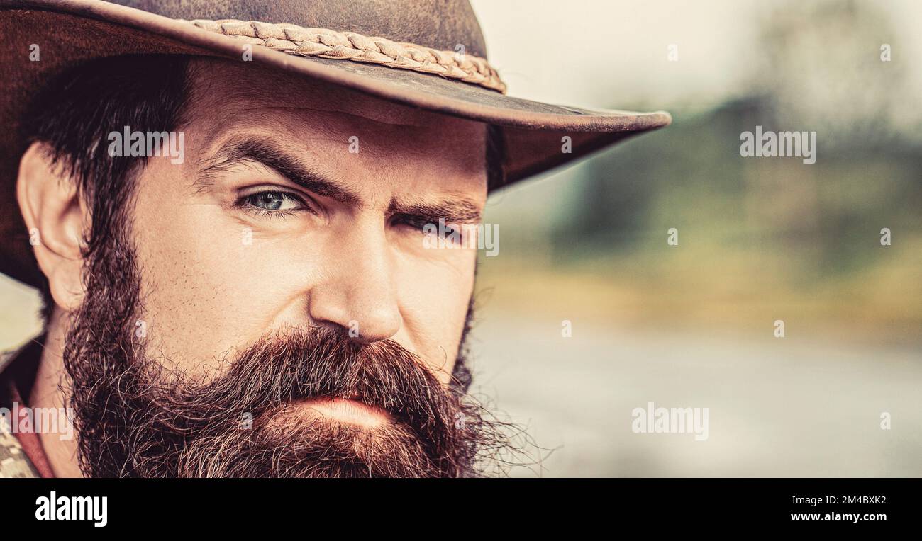 American cowboy. Leather Cowboy Hat. Portrait of young man wearing ...