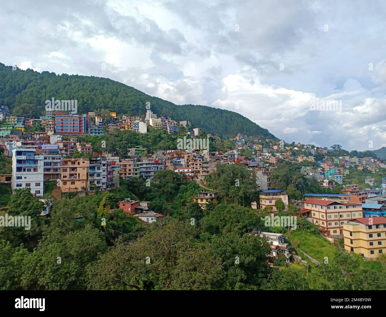 A scenic view of a town and nature with mountains in background Stock ...