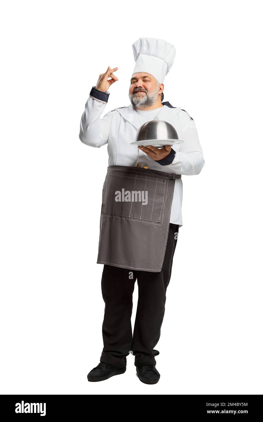 Portrait of bearded man, restaurant chef in uniform posing with plate ...