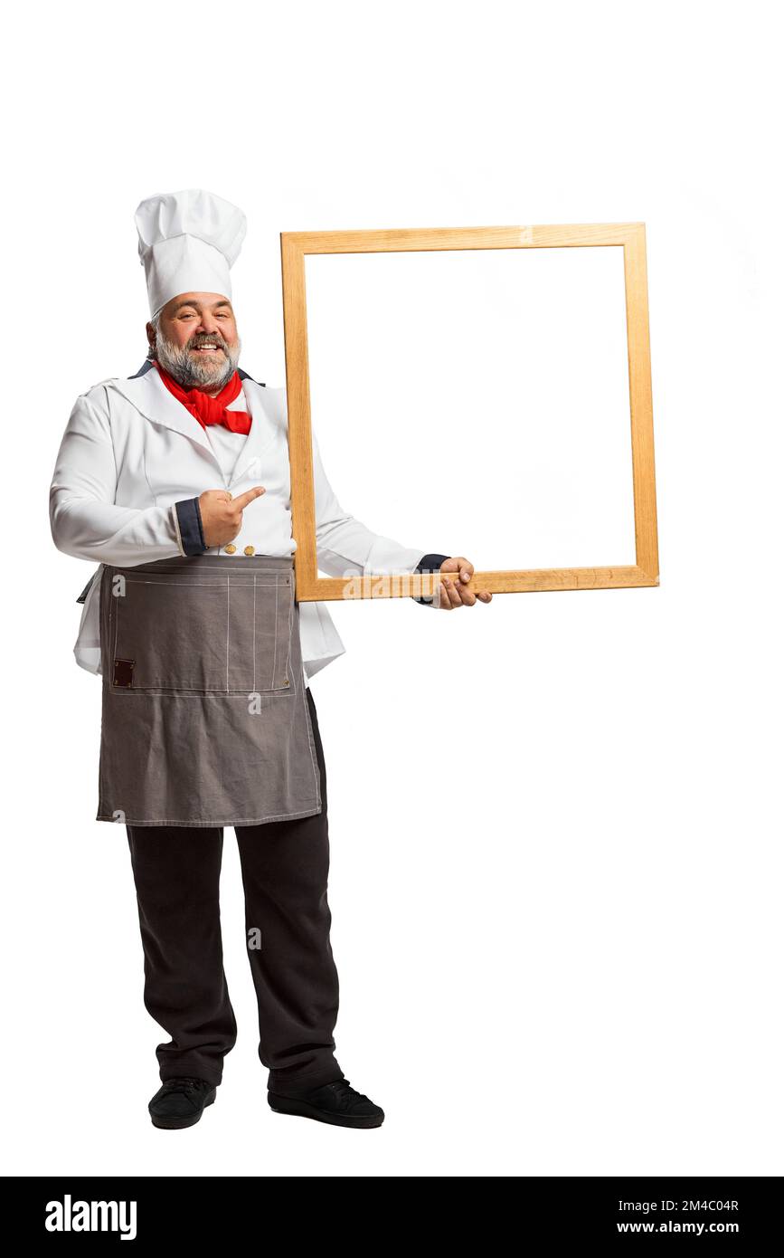 Portrait of bearded man, restaurant chef in uniform posing with frame ...