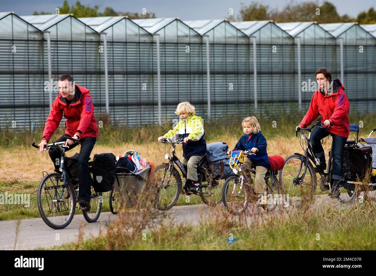 Netherlands - Dutch family on cycling holiday with their luggage in a ...
