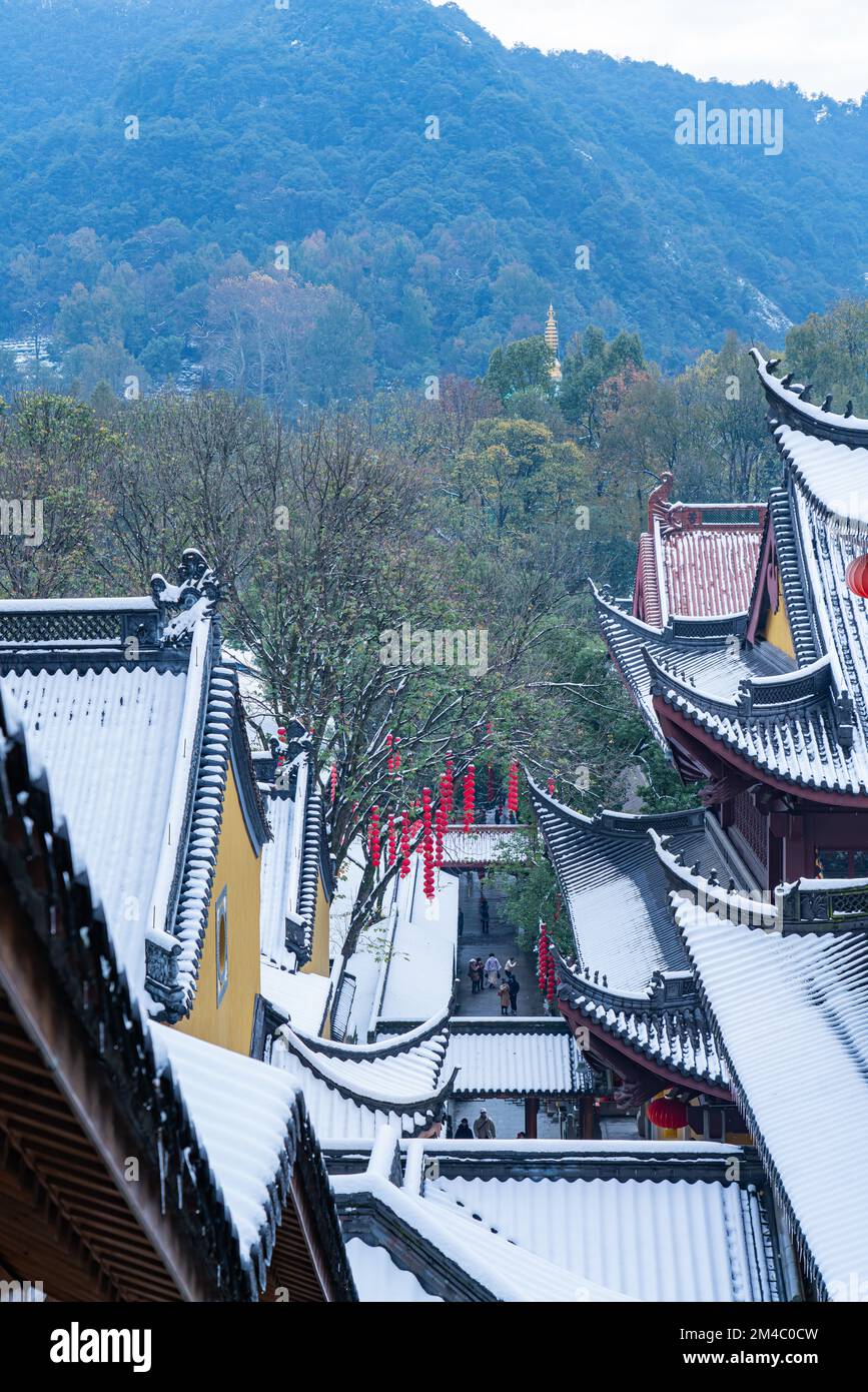 A vertical of a snow-covered Buddhist temple in Hangzhou, China Stock ...