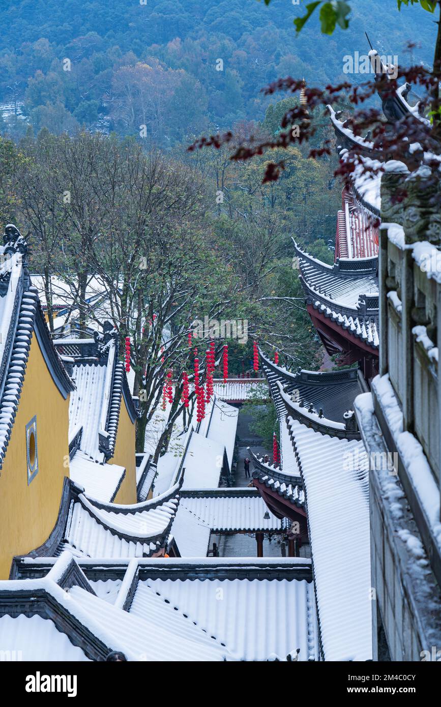 A vertical of a snow-covered Buddhist temple in Hangzhou, China Stock ...