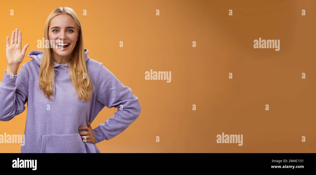 Friendly energized helpful charming female student say hello newcomers ...