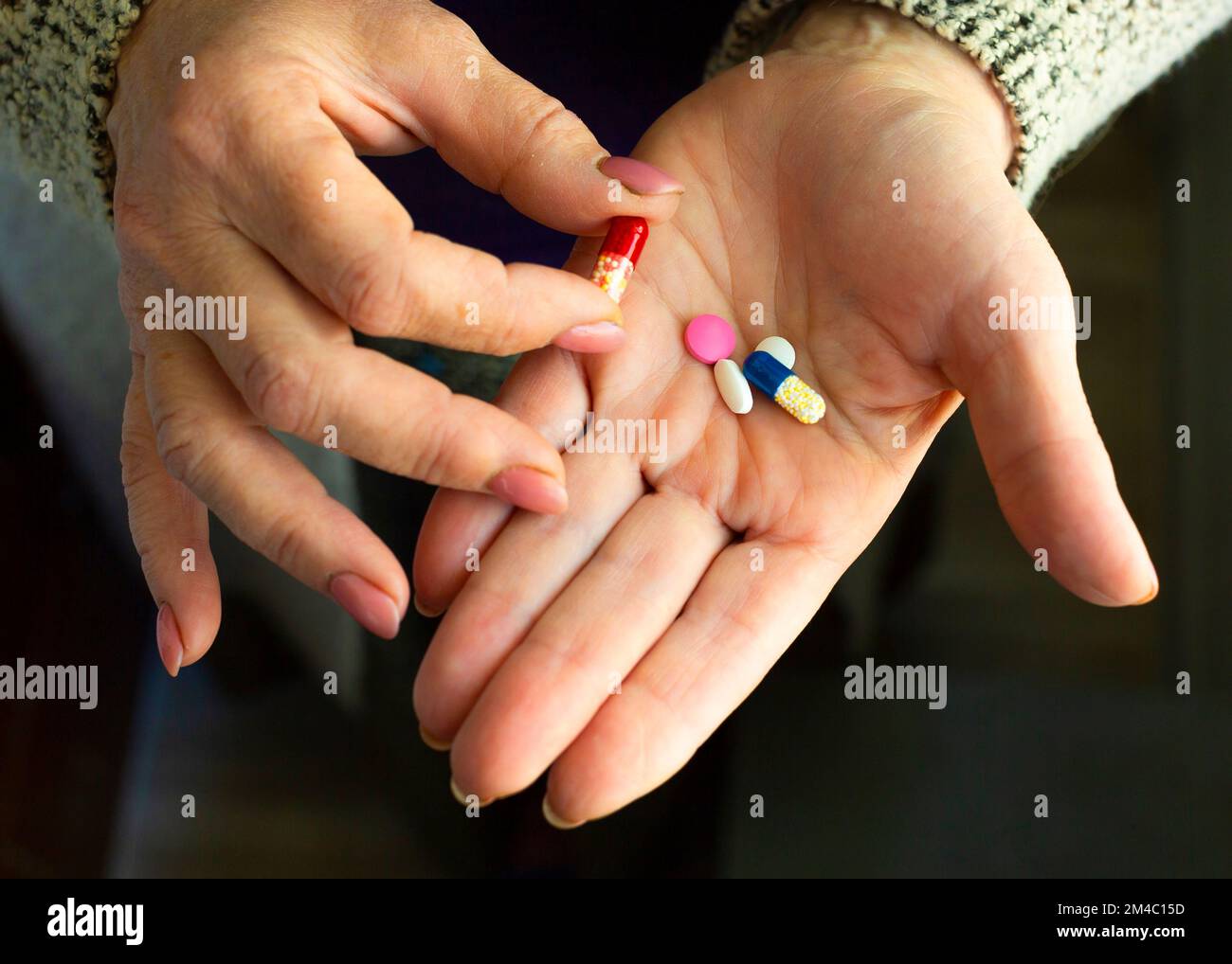 Close up photo of a drugs in old woman's hands. Health care and ...