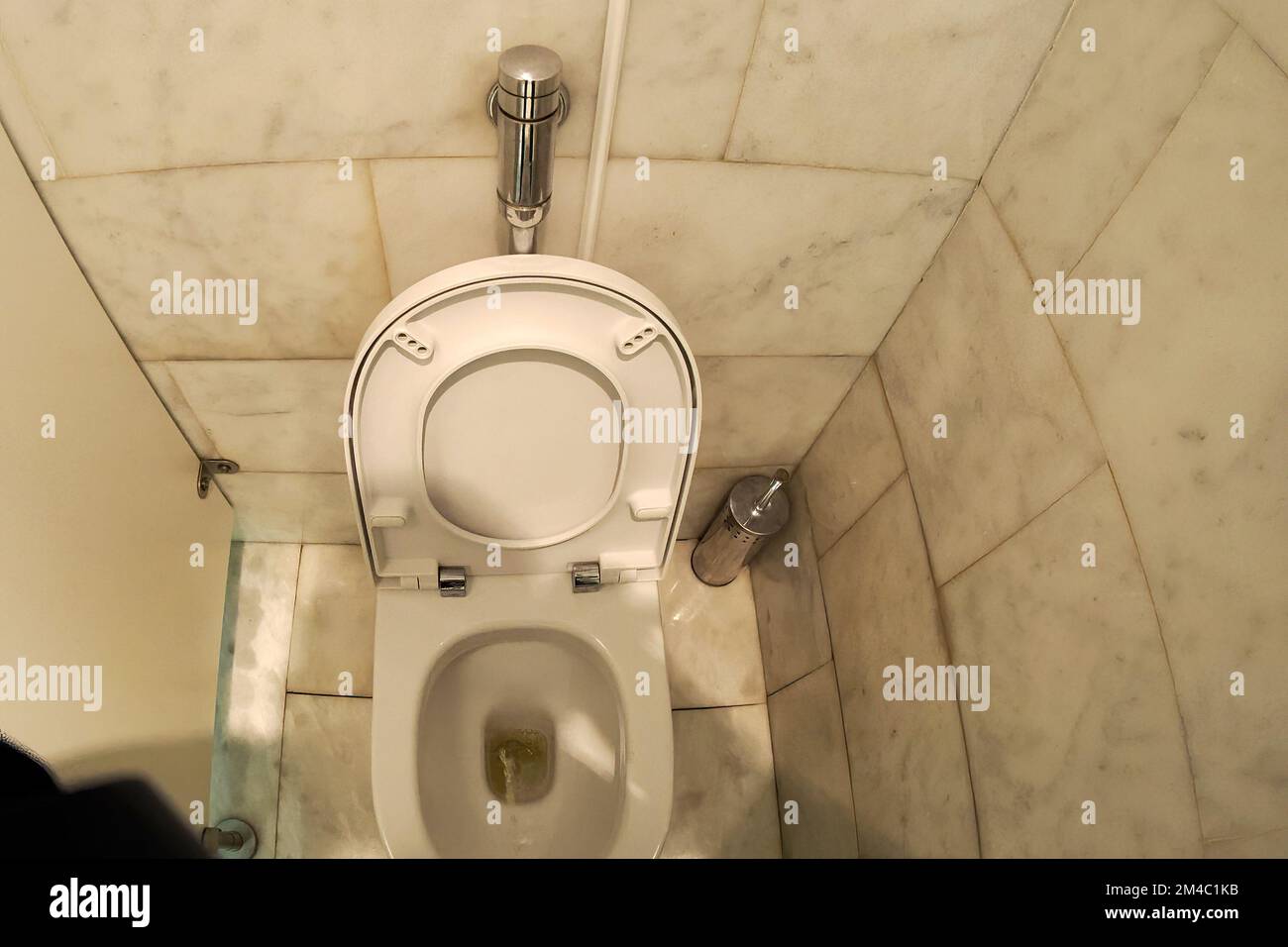 man while urinating in public toilet Stock Photo - Alamy