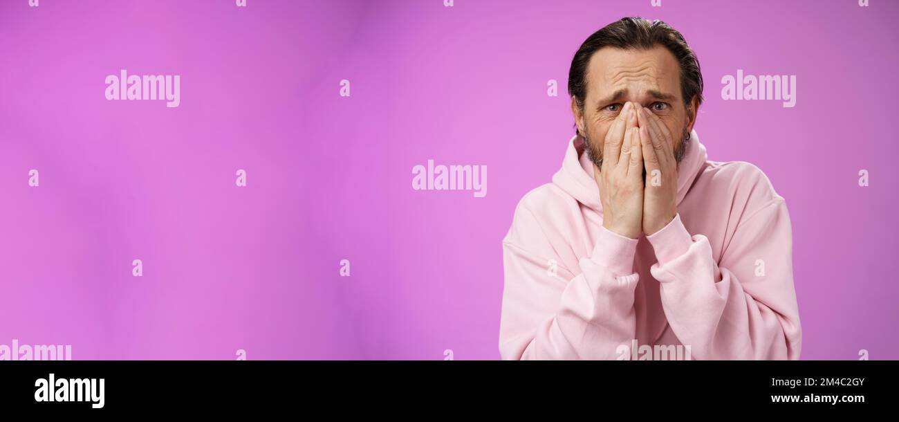 Shocked upset concerned adult husband grieving look heartbroken suffer ...