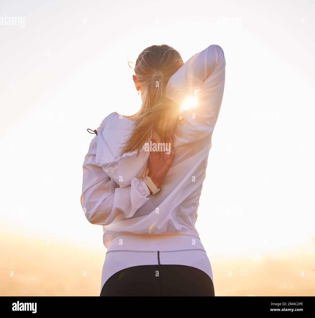 Fitness, stretching and woman exercise at sunset for training, wellness ...