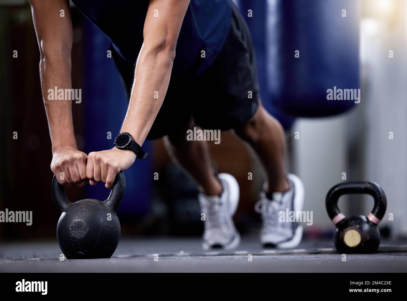 Exercise, kettlebell and strong hands man doing gym workout with a ...