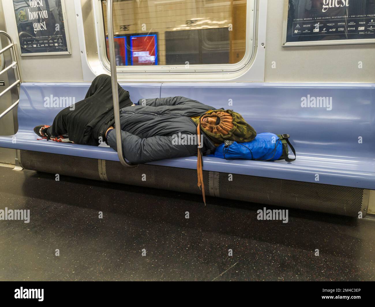 Homeless man sleeping in subway hi-res stock photography and images - Alamy