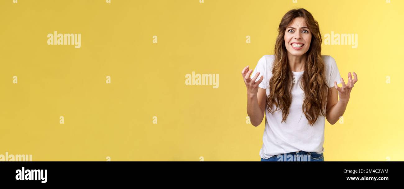 Annoyed curly-haired caucasian irritated distressed girl cringe ...