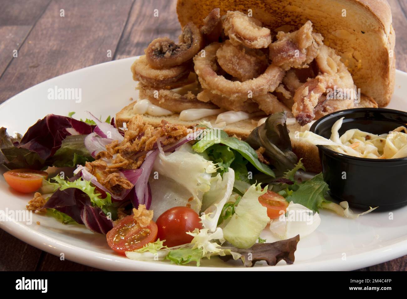 A great sandwich of fried calamari typical of Spanish bars Stock Photo ...