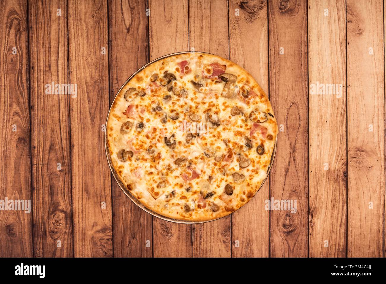 A large Italian family style carbonara pizza viewed from above on a ...