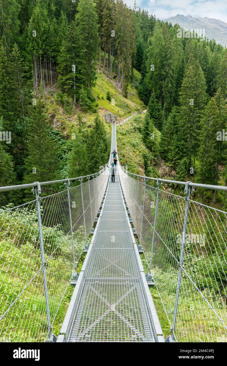 suspension bridge on the ragaiolo stream, rabbi valley, italy Stock ...