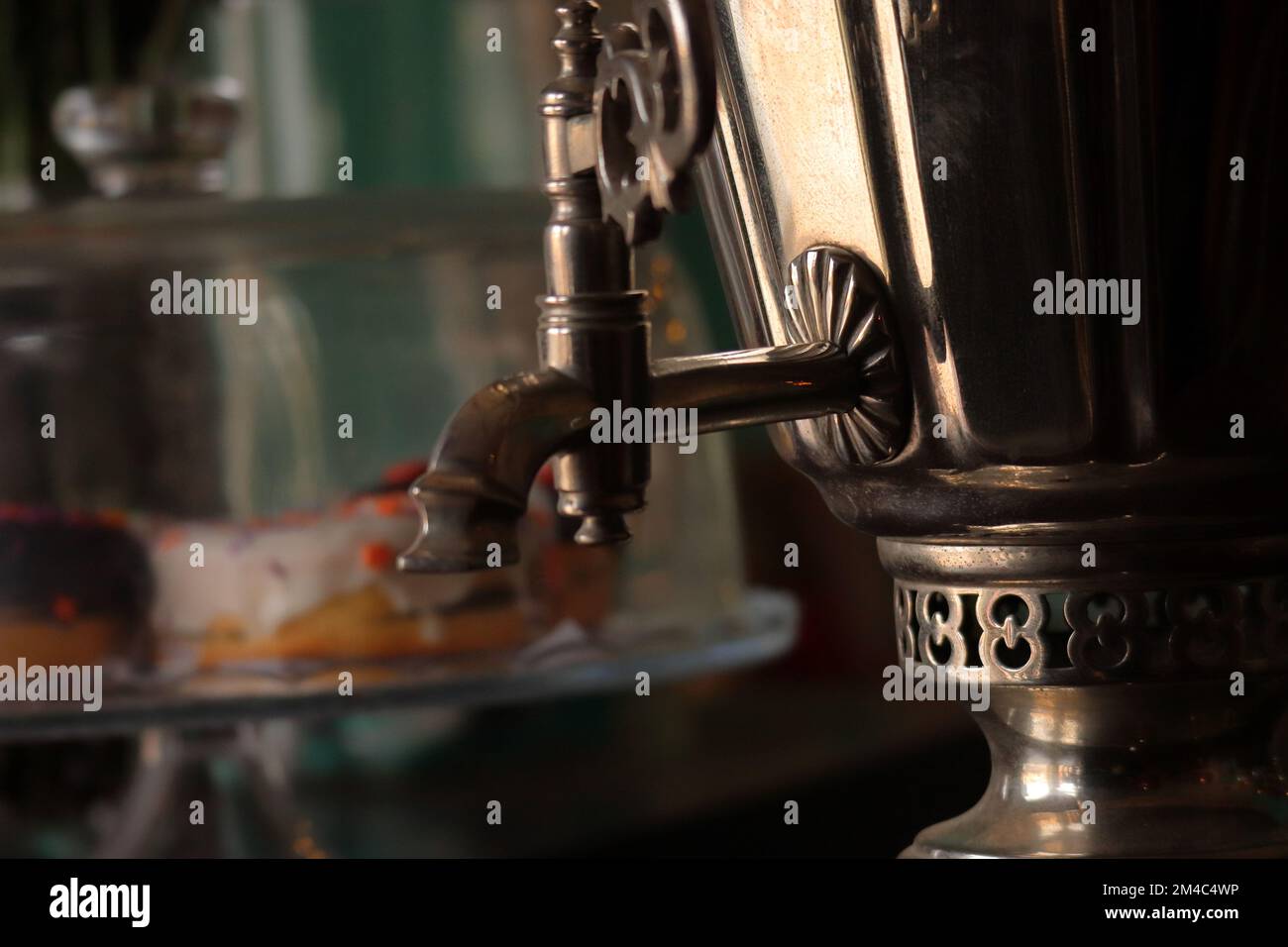 Spout tap of glass amphora inside coffe shop Stock Photo - Alamy