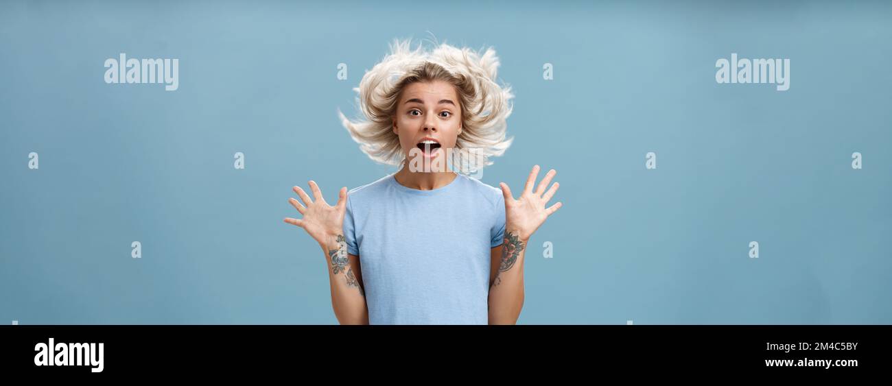 Waist-up shot of impressed surprised attractive and cute girl with ...