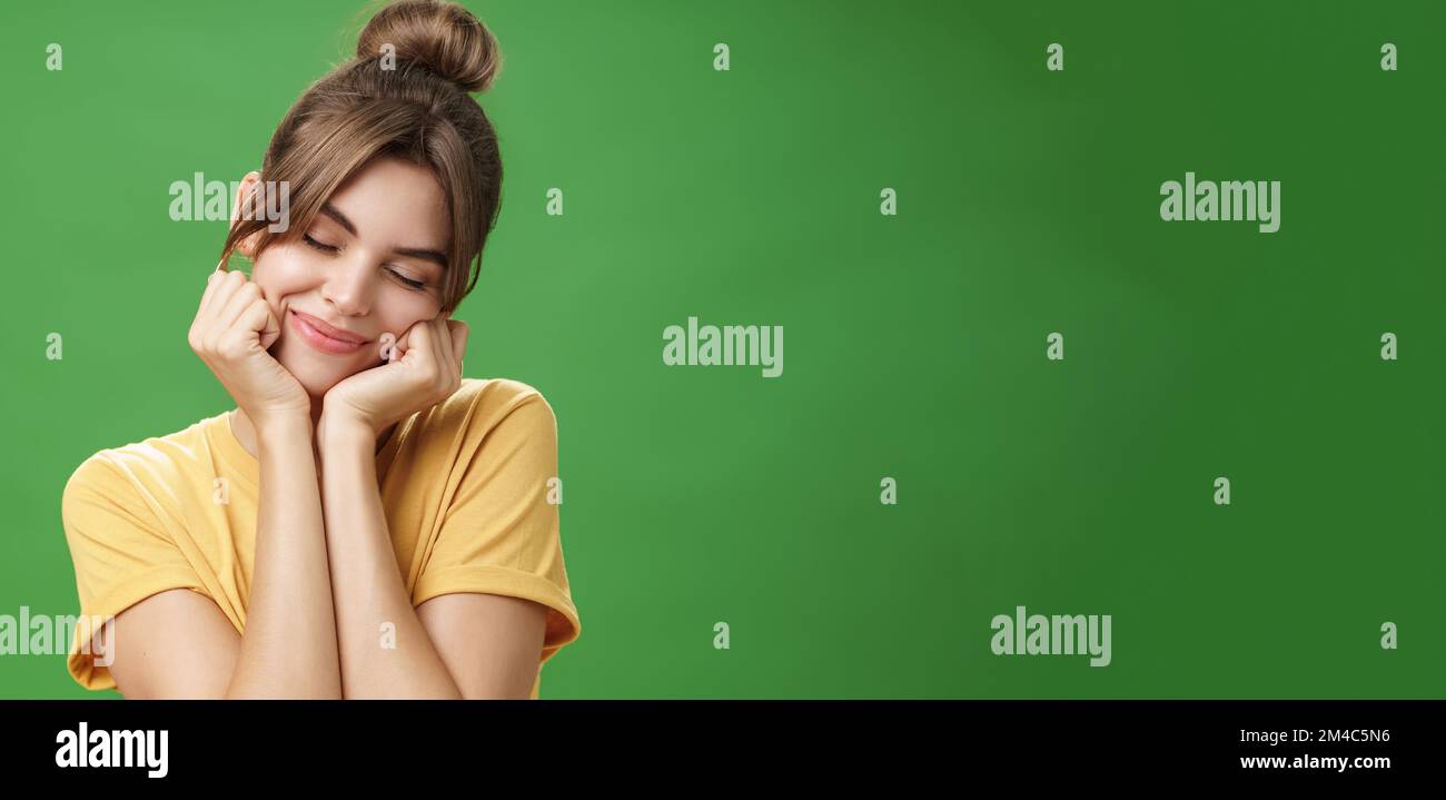 Tender sensual timid european girl in yellow t-shirt leaning head on ...