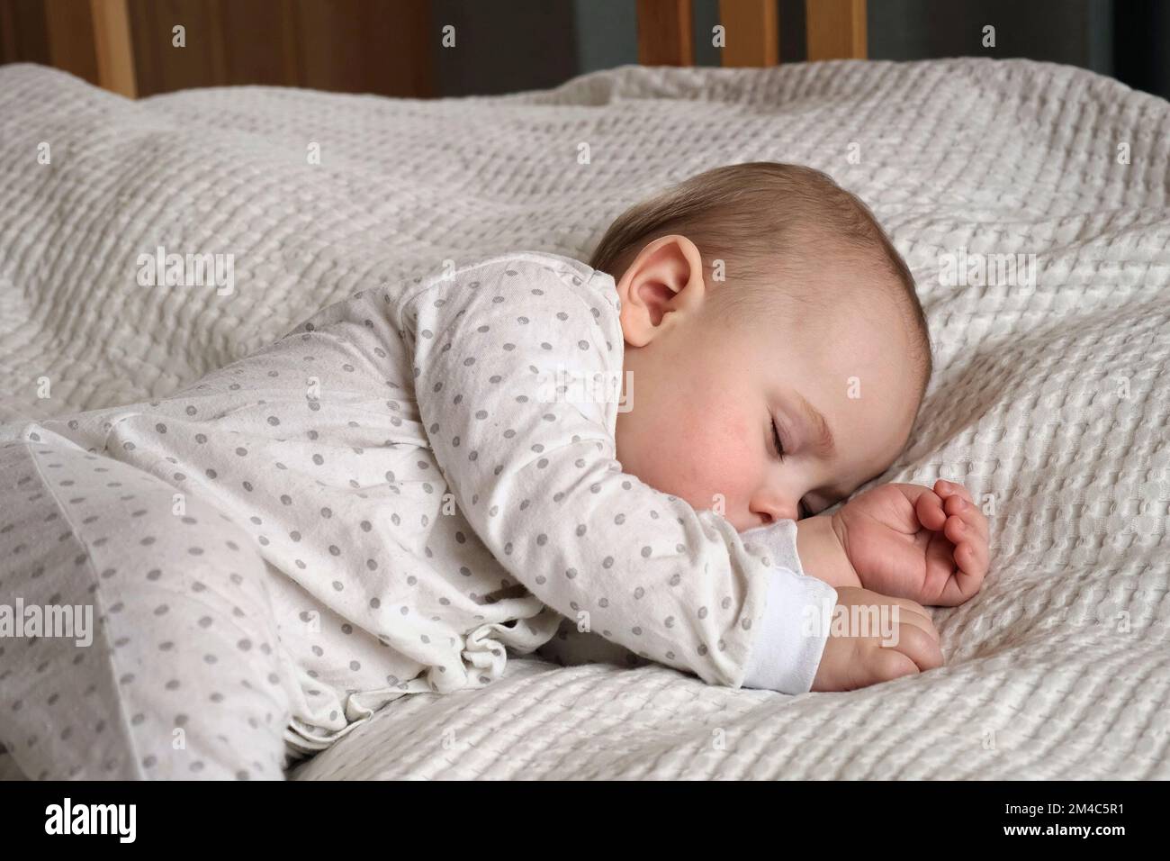 Peaceful adorable baby sleeping on his bed at home. Sleeping newborn ...