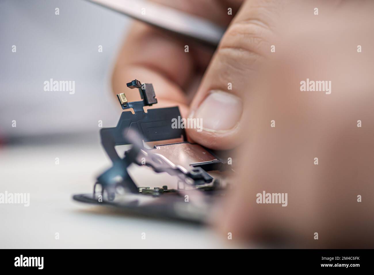 Cell phone repair at service center, smartphone disassembling and ...