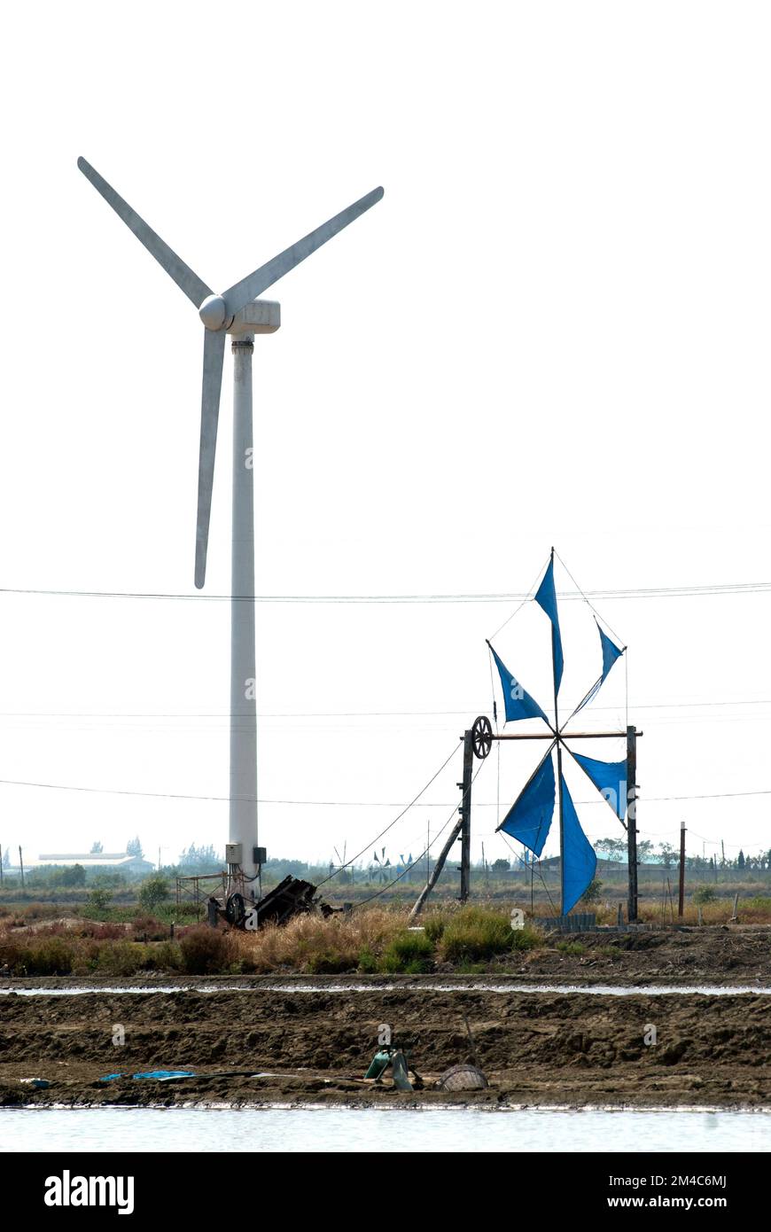 Ancient and new wind mill use for move the sea water into the salt ...