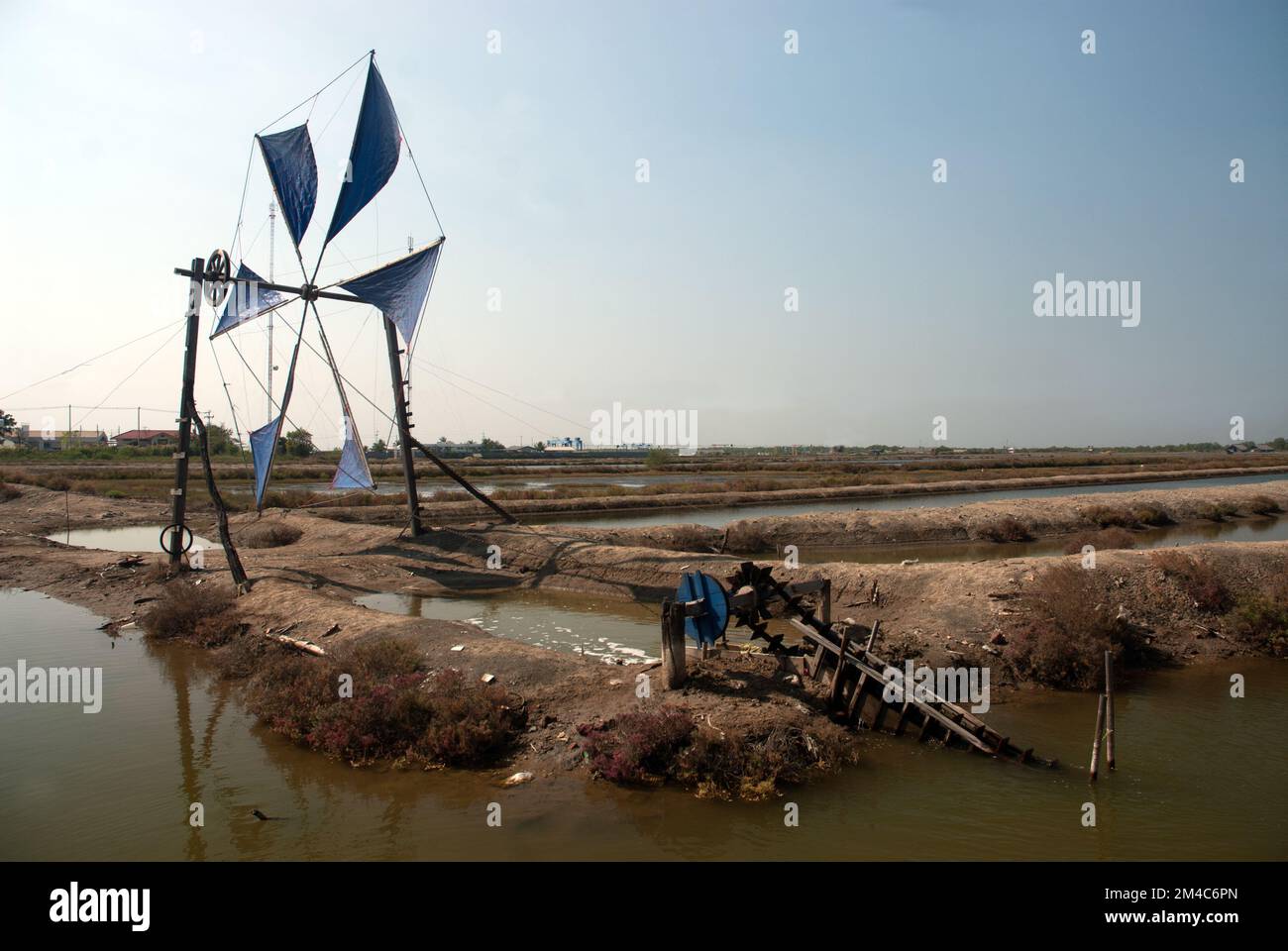 Ancient and new wind mill use for move the sea water into the salt ...