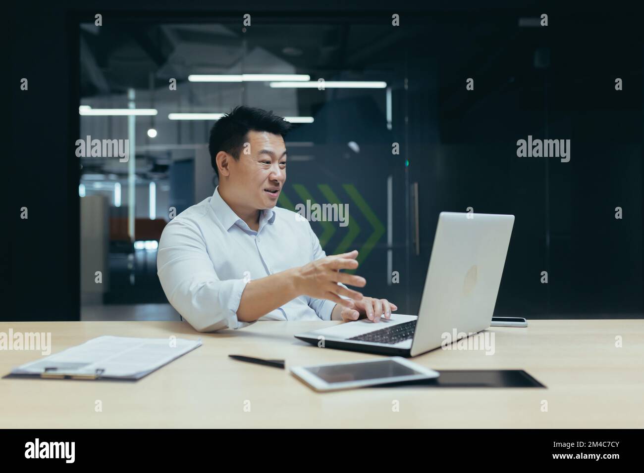 Confident young Asian man conducting online business training, webinar ...