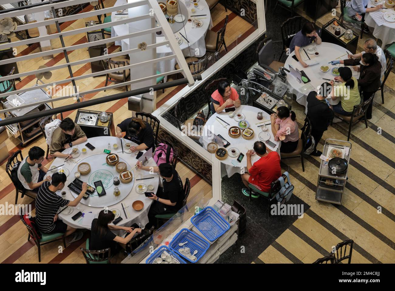 People having lunch at shopping mall in Tsing Yi. Government easing of ...