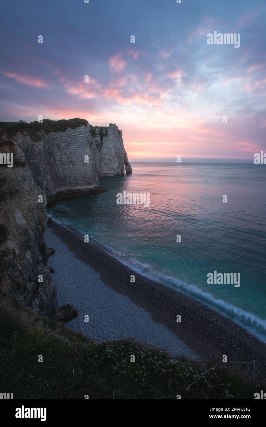 A sunset scene over The famous white cliffs of Etretat and the Alabaster Coast, Normandy, France ...