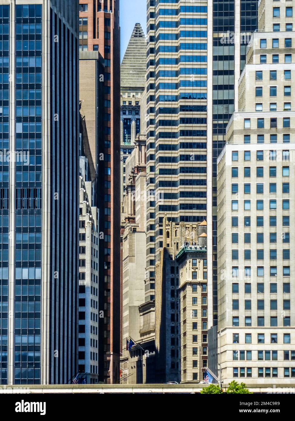 A street view of a city downtown with modern buildings and skyscrapers ...
